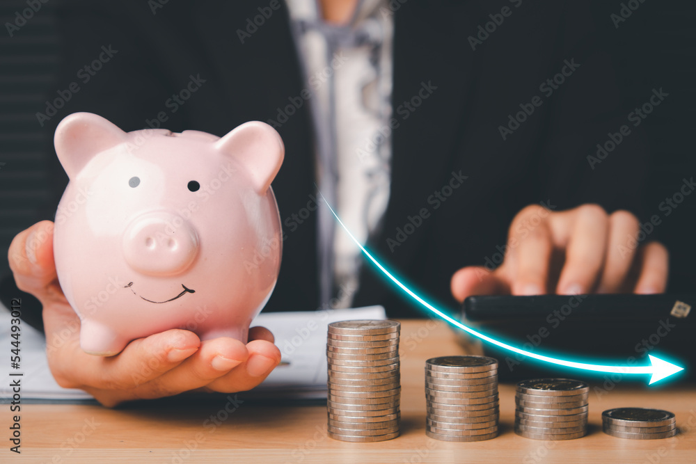 Cost reduction business finance concept, Business woman hand holding ... Cost reduction business finance concept, Business woman hand holding ...