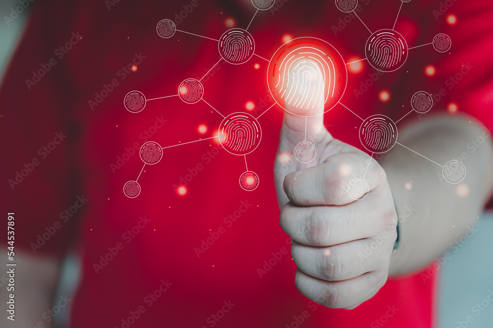 Foto de Man use a thumb scanning overlay with futuristic hologram. the ...