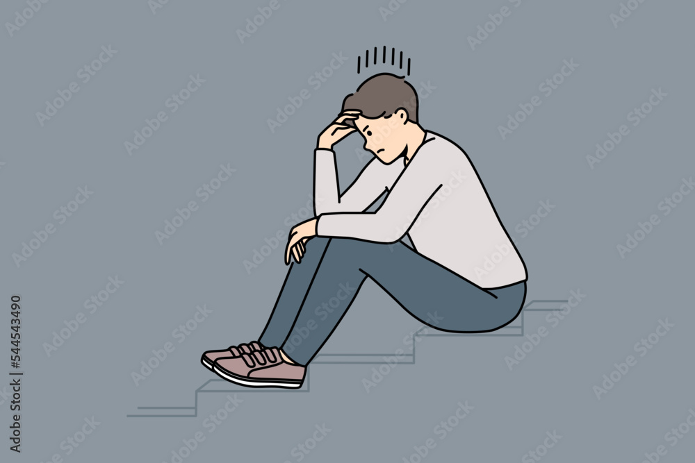 Stressed man sit on stairs thinking or making plan. Distressed unhappy ...