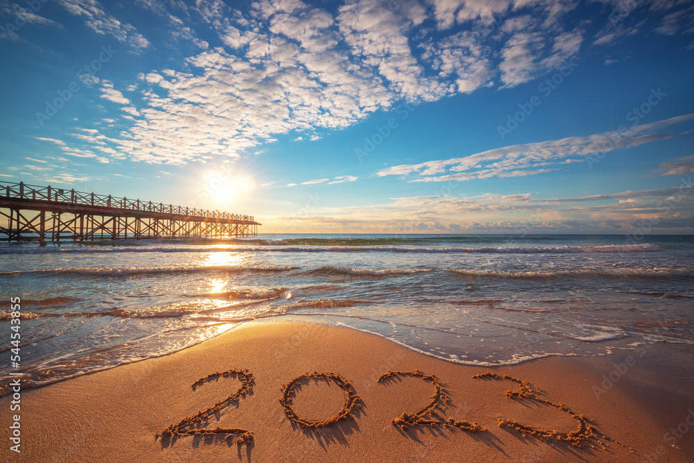 Happy New Year 2023 concept, lettering on the beach. Written text on ...