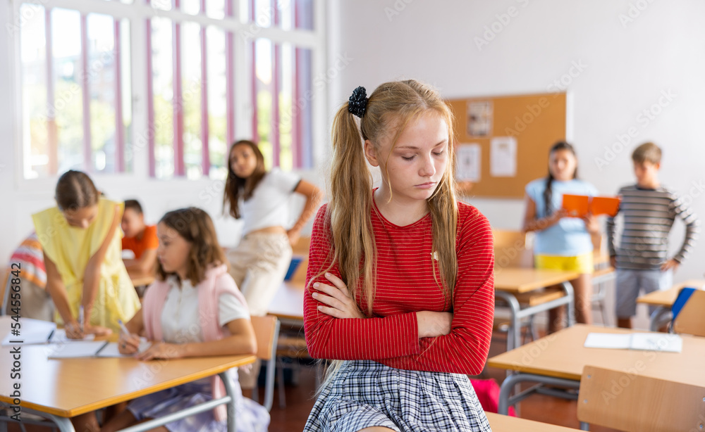 Girl Sitting Alone In School