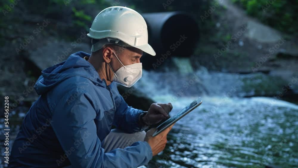 Video Stock Engineer worker checking water quality of river. Wastewater ...