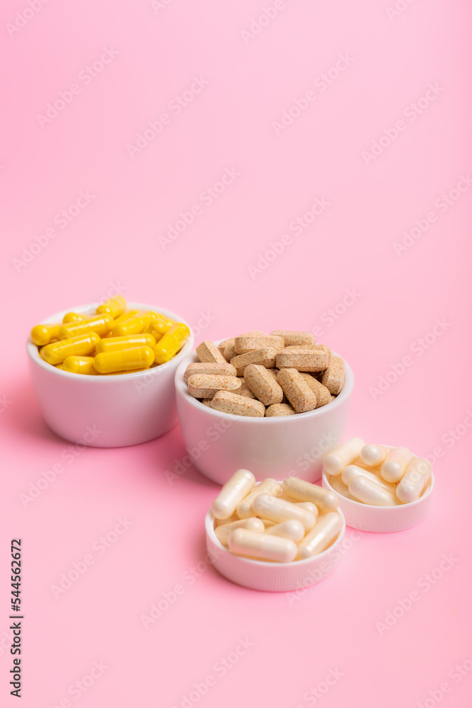 Food supplements, vitamins and minerals in forms of tablets, capsules ...