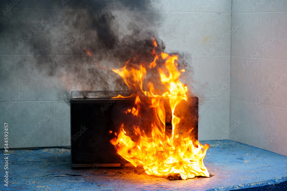 microwave oven on fire. the concept of fire in the kitchen and ...