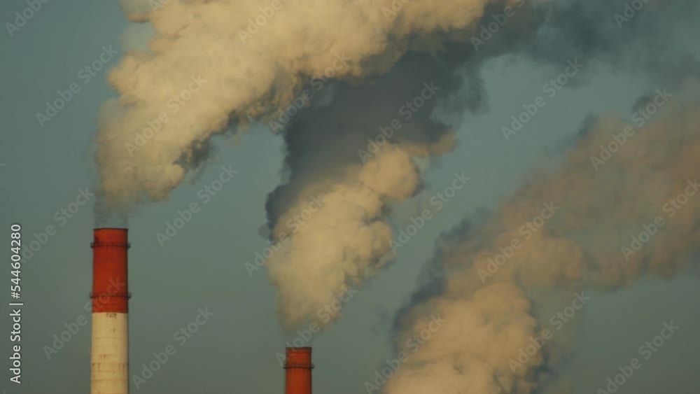 Air pollution from industrial chimneys spew clouds smoke in sky ...