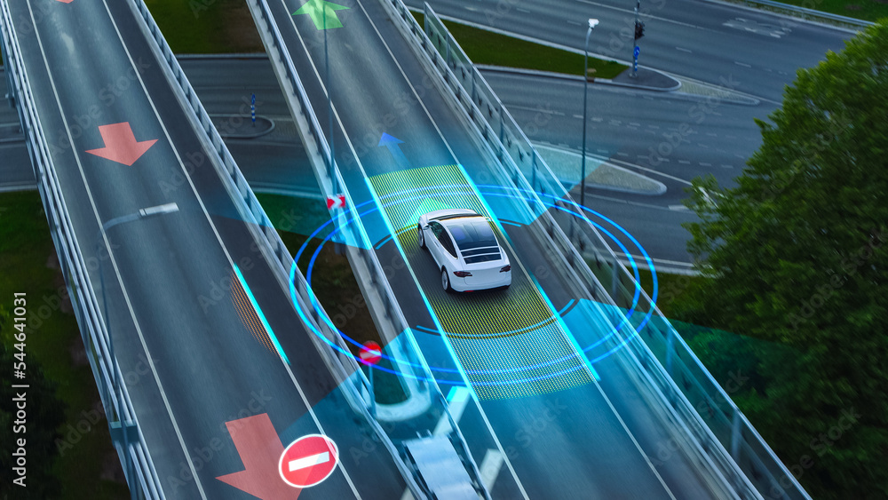 Following Aerial Drone View: Autonomous Self Driving Car Moving Through ...