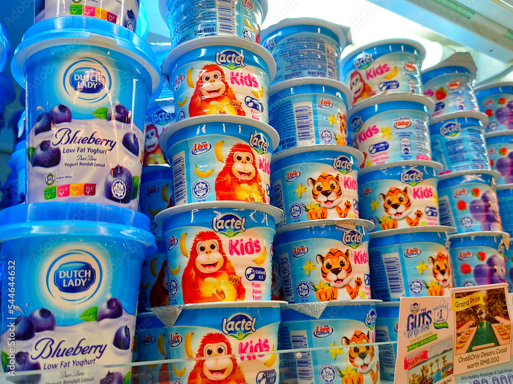 JOHOR, MALAYSIA -JULY 6, 2022: Yogurt in commercial packs. Small cup ...