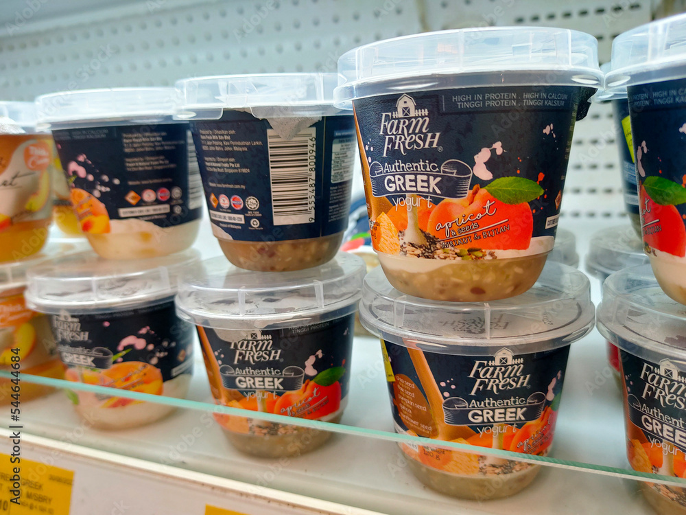 JOHOR, MALAYSIA -JULY 6, 2022: Yogurt in commercial packs. Small cup ...