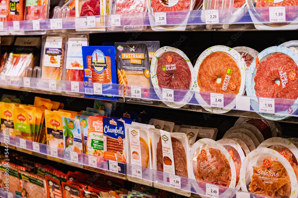 26 July 2022, Munster, Germany: sausage and sliced salami in vacuum ...