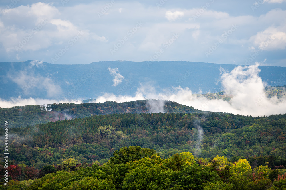 Morning fog clouds sky weather rising mist in early fall autumn foliage ...