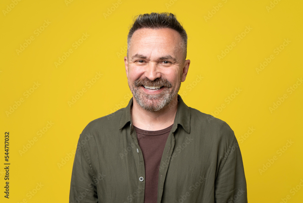 Portrait of 50s handsome smiling man with beard and short haircut ...
