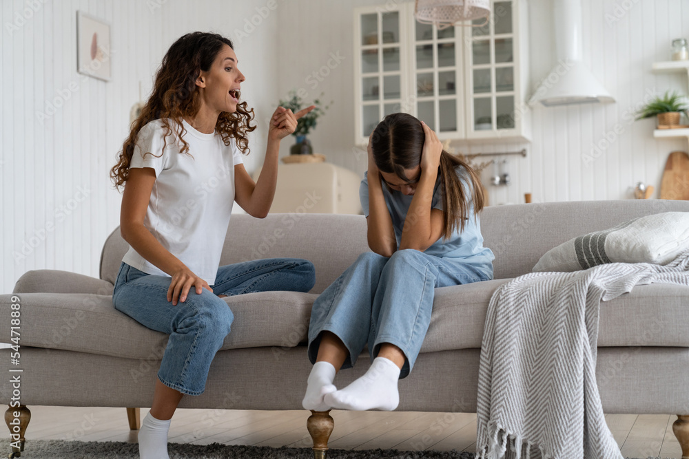 Mother yelling at her daughter teenage girl, parent losing control getting angry, emotional ...