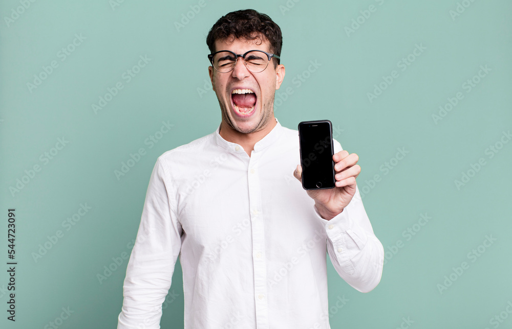 adult man shouting aggressively, looking very angry and showing his ...