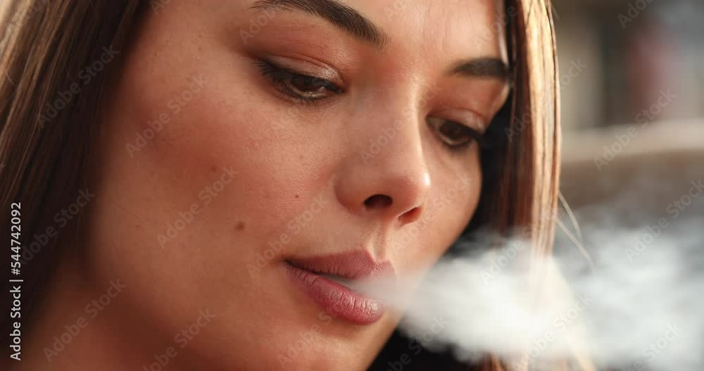 young beautiful woman smoking cigarettes Stock Video | Adobe Stock