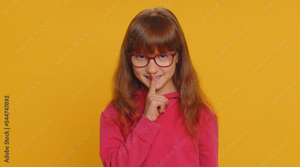 Shh be quiet please. Preteen child girl kid presses index finger to ...
