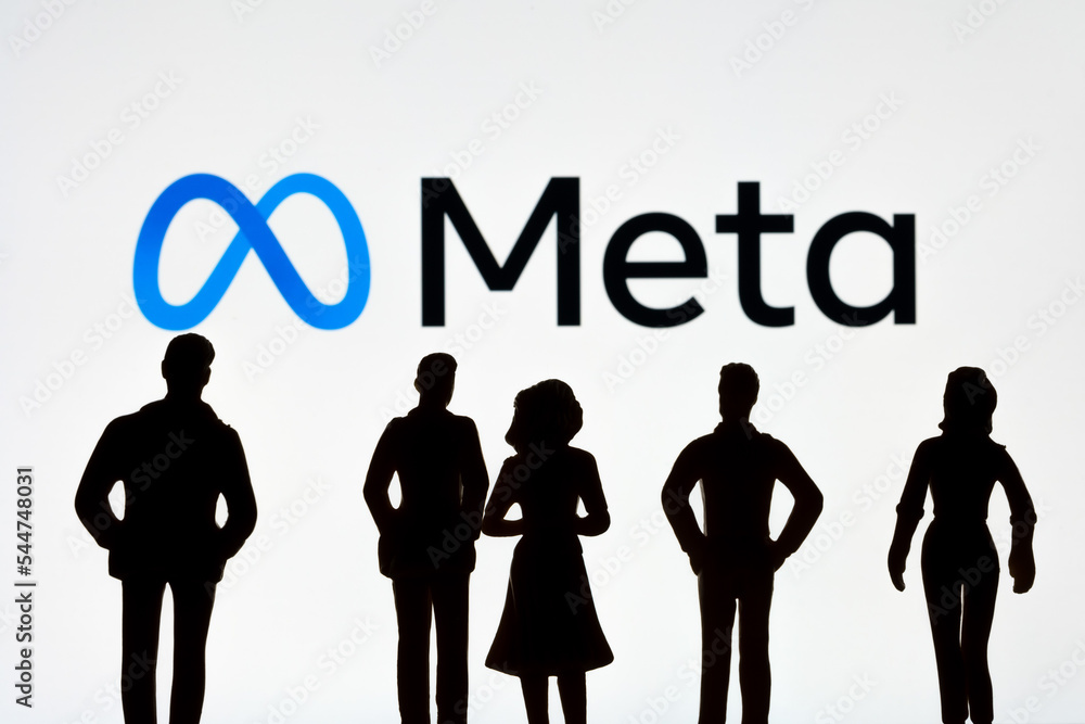 silhouette of mini figurines of people and Meta company logo. Concept ...