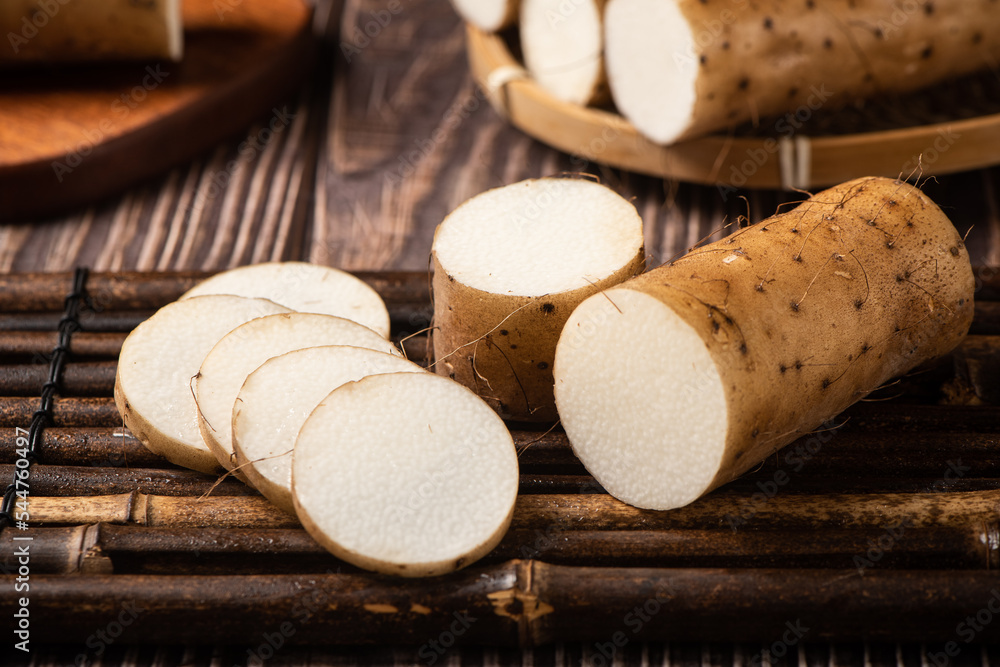 fresh Chinese yam on wooden table Stock Photo | Adobe Stock