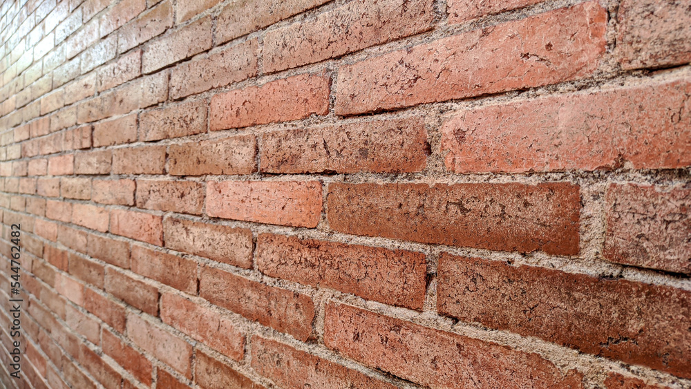 Exposed red brick walls that are neatly installed. Photographed from ...