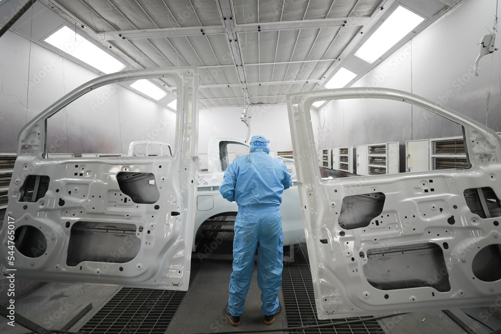 Standard auto repair shop is repairing and repainting the car after the ...