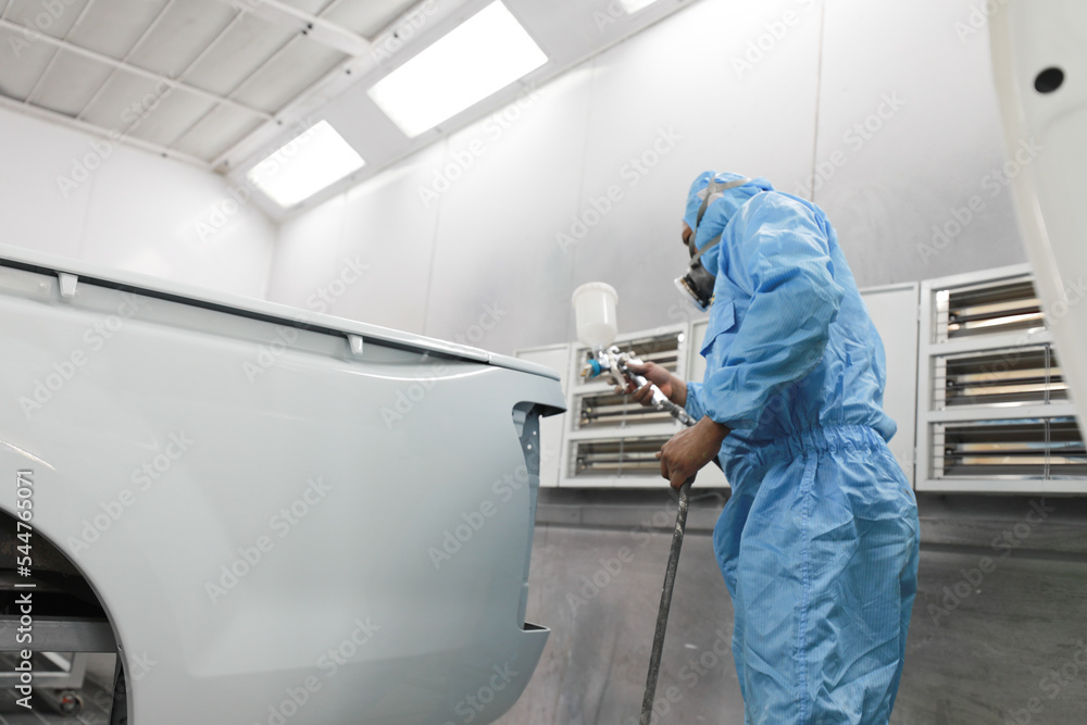 Standard auto repair shop is repairing and repainting the car after the ...