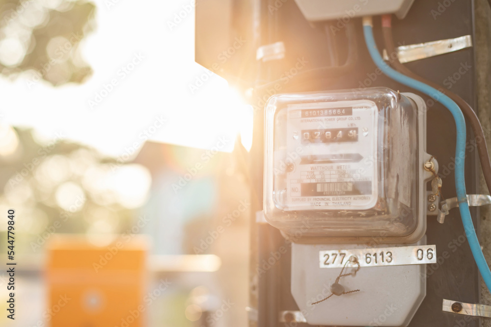 Electric meter installed on the pole to measurement watt in the house ...
