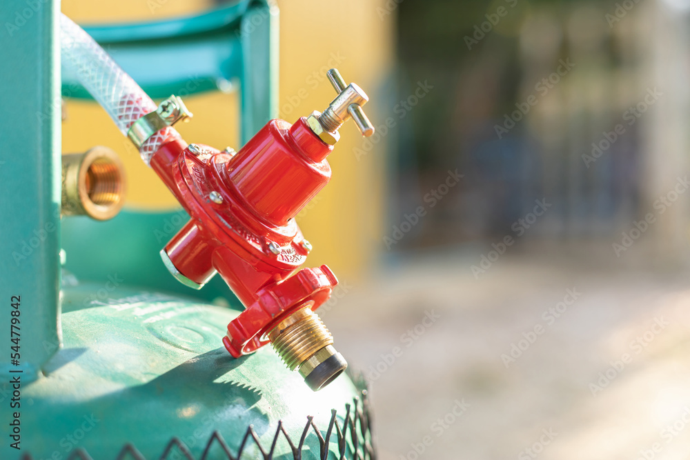 Metal valve for close or open on new green cooking gas tank. safety ...