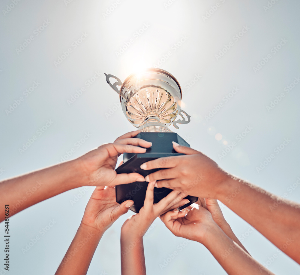 Teamwork, sports and hands of people with trophy for winner ...