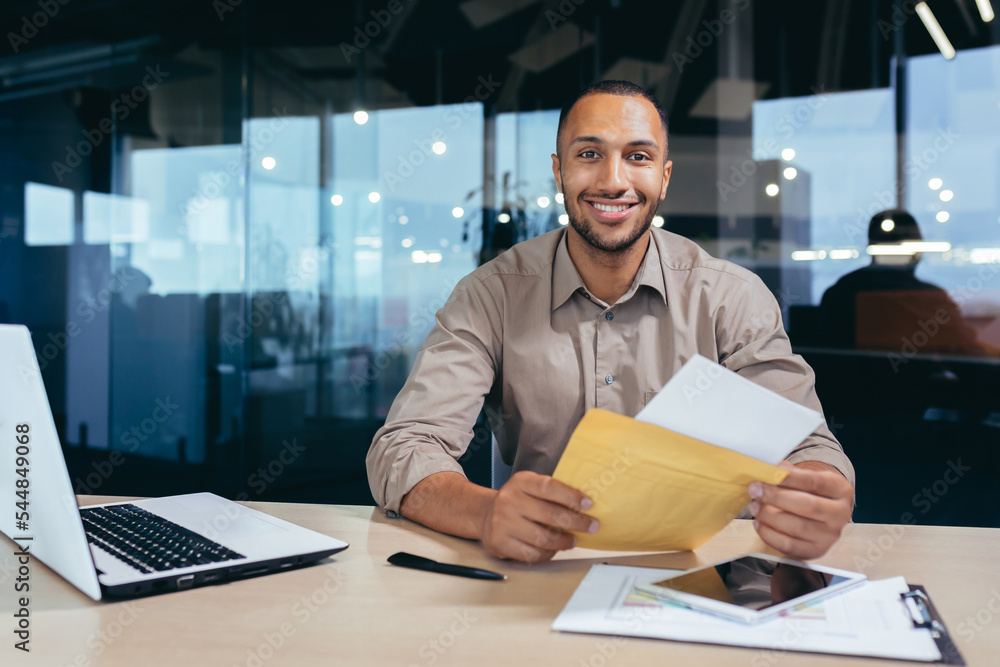 Portrait of happy african american man in office doing paperwork, man ...