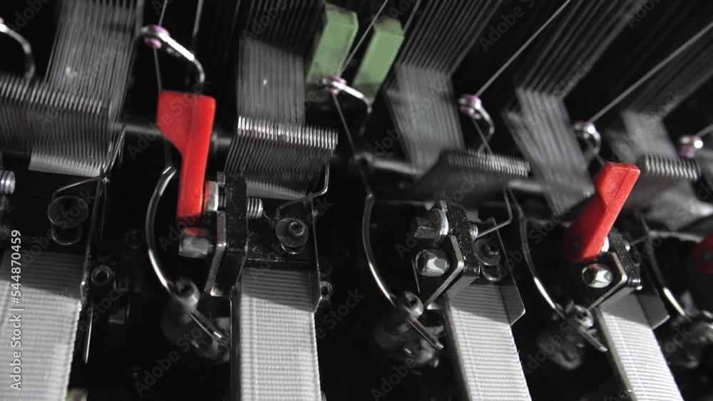 Close up of textile machine in slow motion. Fibre thread lines on the ...
