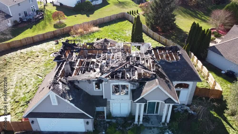 Aerial view burnt house with destroyed single roof of two story single ...