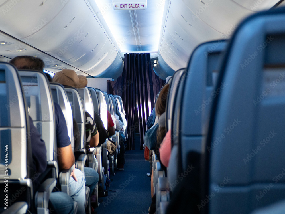 passengers inside airplane Stock Photo | Adobe Stock