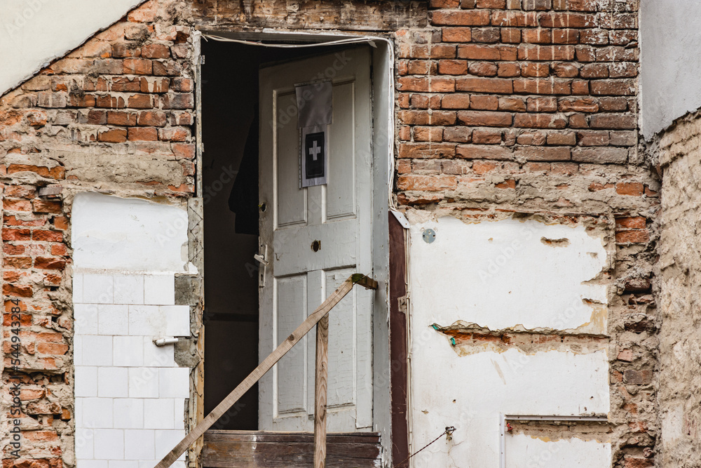 Poor hospital for people in poverty with falling pieces and brick wall ...