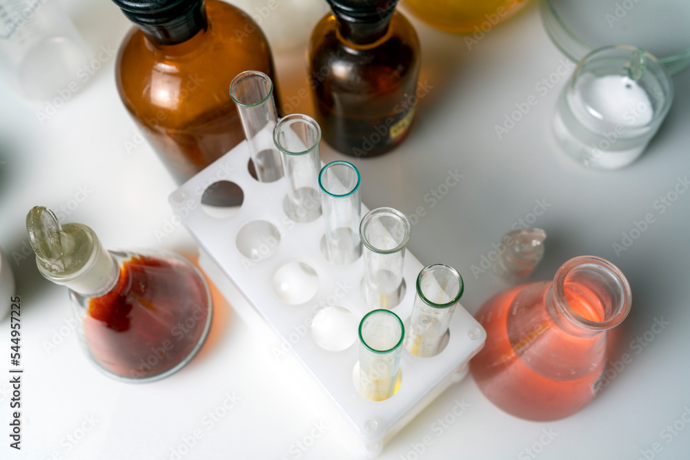 Food additives in test tubes and flasks on the laboratory table. food ...