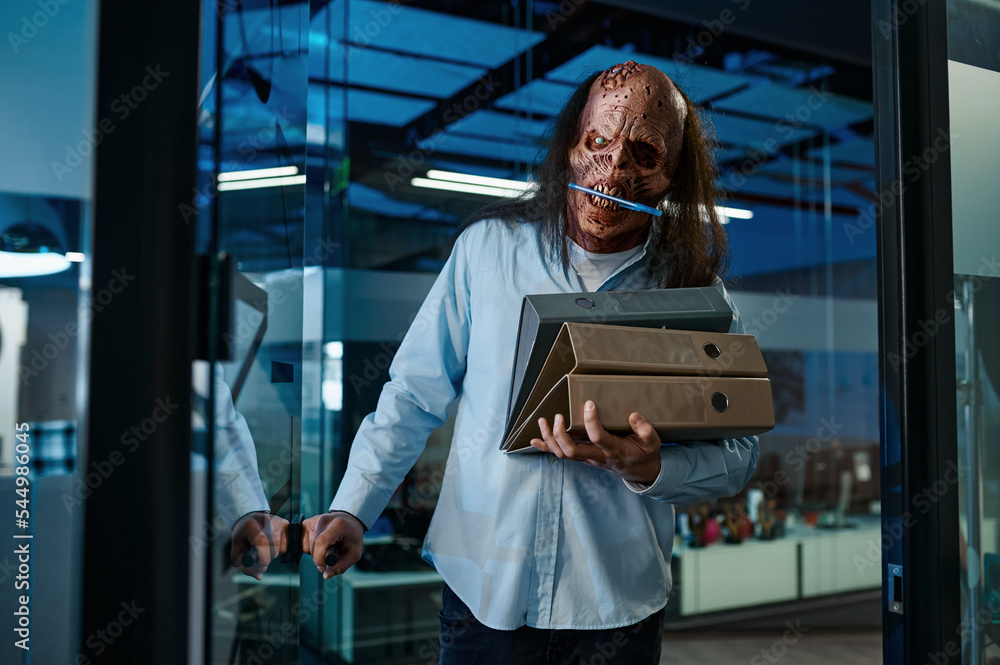 Zombie employee carrying folder binder stack on office Stock Photo ...