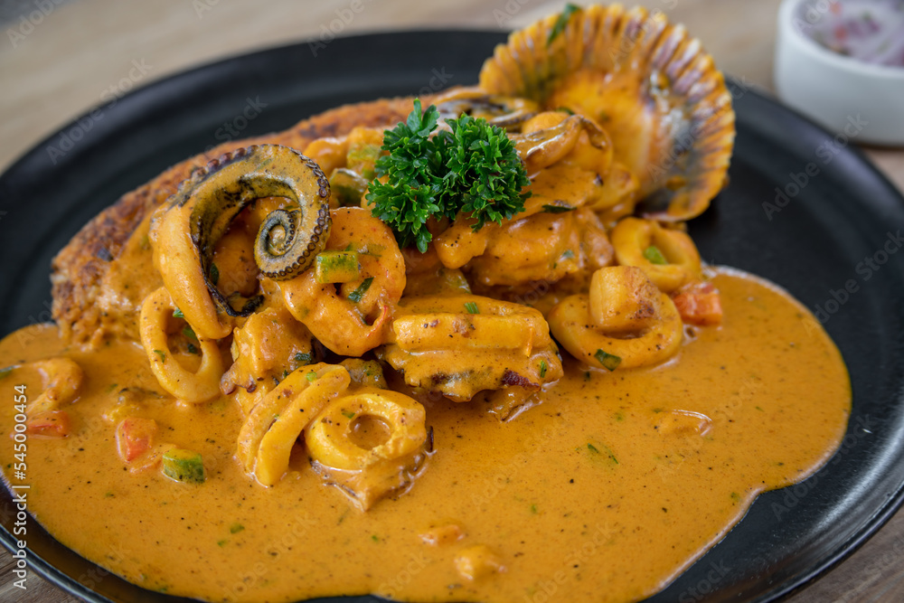Typical peruvian food and drinks, tacu tacu with octopus Stock Photo ...