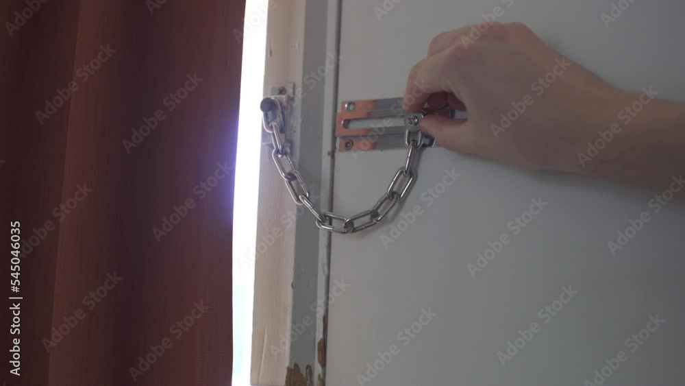 Man locks chain link lock on door in apartment/motel/hotel Stock Video ...