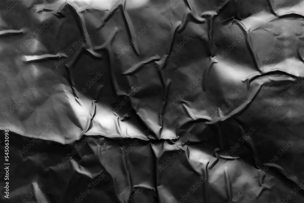 black crumpled and creased plastic poster texture background Stock ...