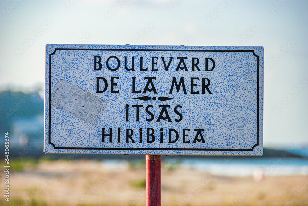 Name sign of a street, Avenida de la Mar, in French and Basque ...