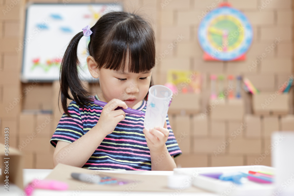 young girl making craft for homeschooling Stock Photo | Adobe Stock