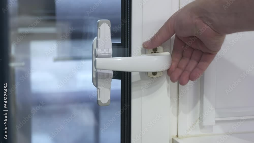 Replacement handles on pvc glass door window on the balcony. Child ...