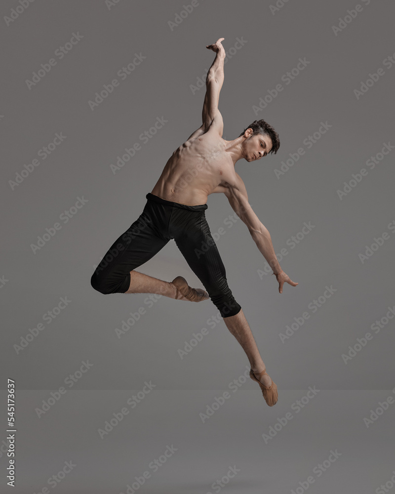 Portrait of young muscular man, ballet dancer performing isolated over ...