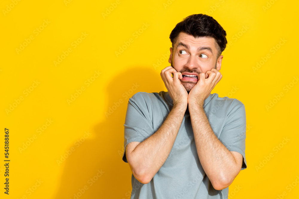 Portrait photo of young funny nervous impressed man shocked biting ...