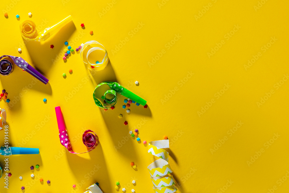 Abstract colored party background. Multi-colored party horns ...