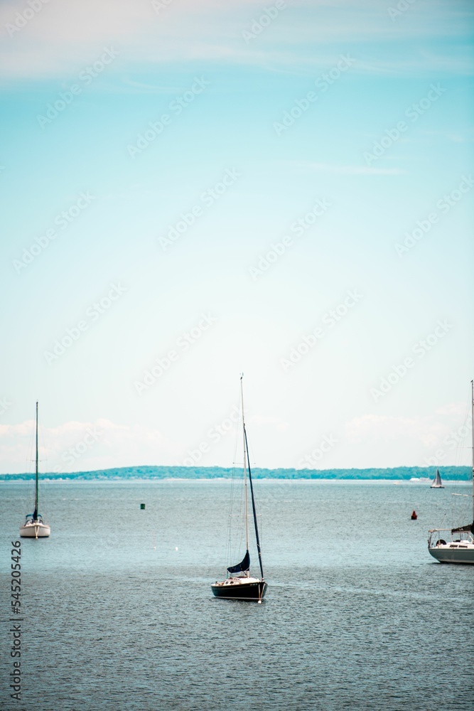 Vertical high-angle of boats sailing on the sea skyline background ...