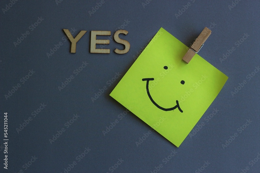 Smiley post-it with Yes text on a gray background Stock Photo | Adobe Stock