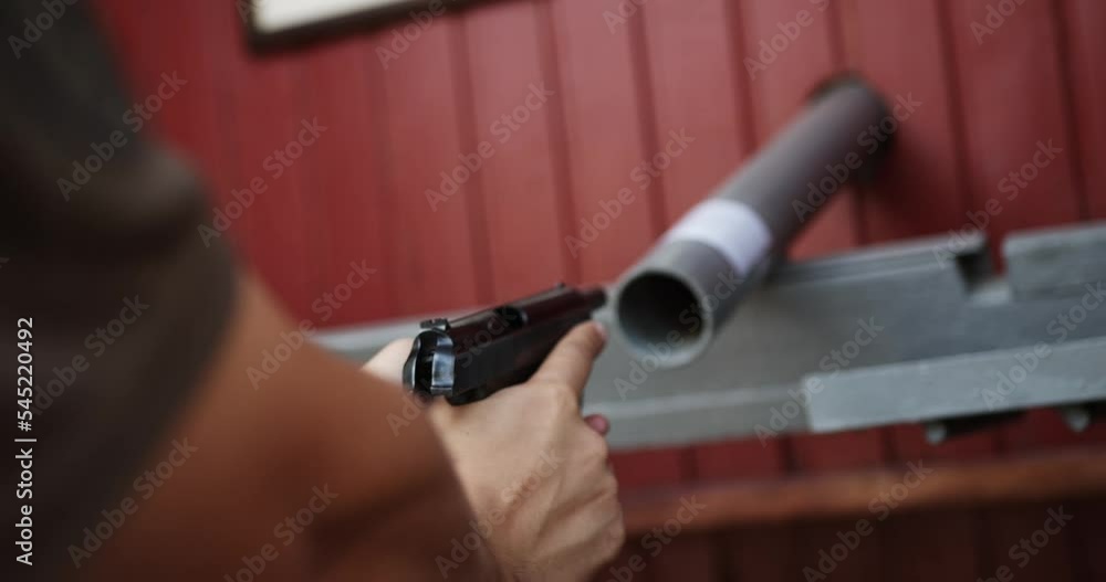 checking weapons for bullets. blank shot into the pipe. the soldier ...