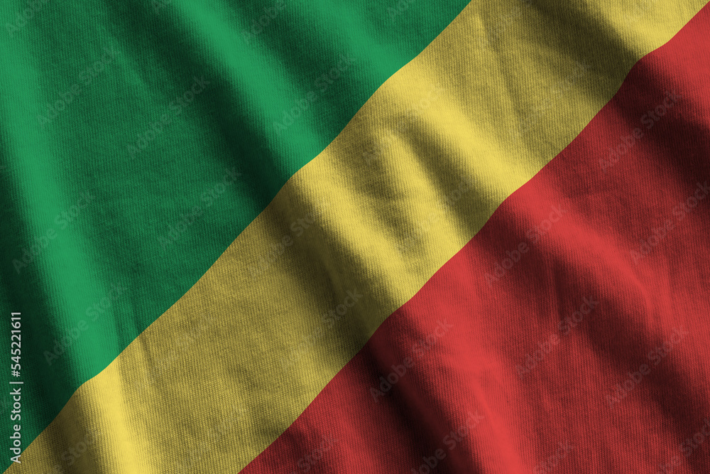 Congo flag with big folds waving close up under the studio light ...