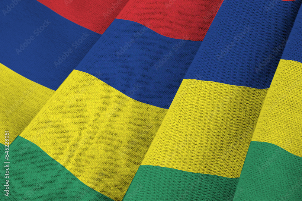 Mauritius flag with big folds waving close up under the studio light ...