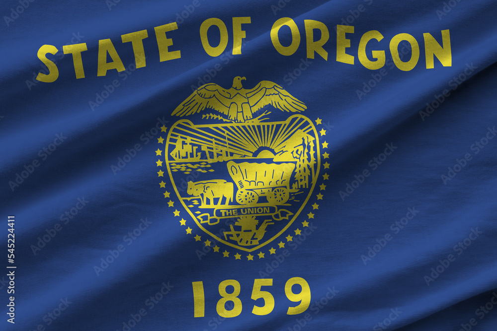 Oregon US state flag with big folds waving close up under the studio ...