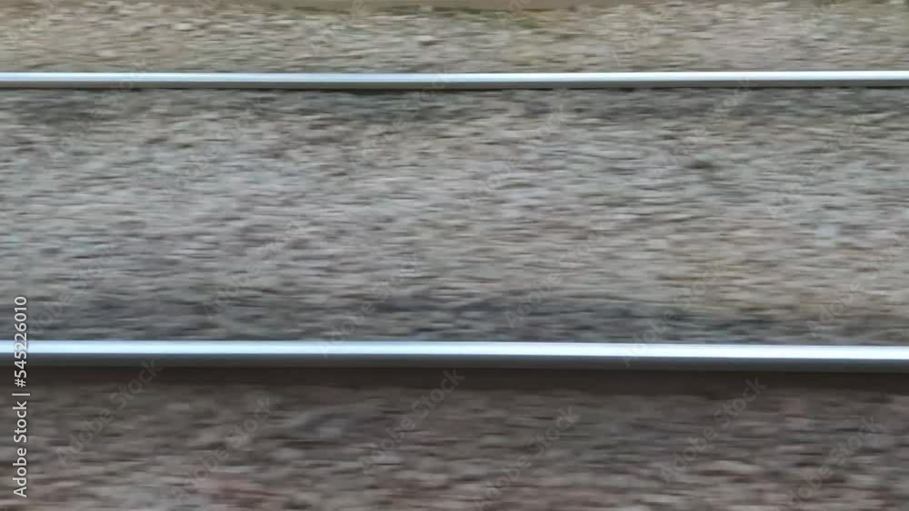 Vídeo do Stock: Tram rails on brownish gray stones. On dry granite ...